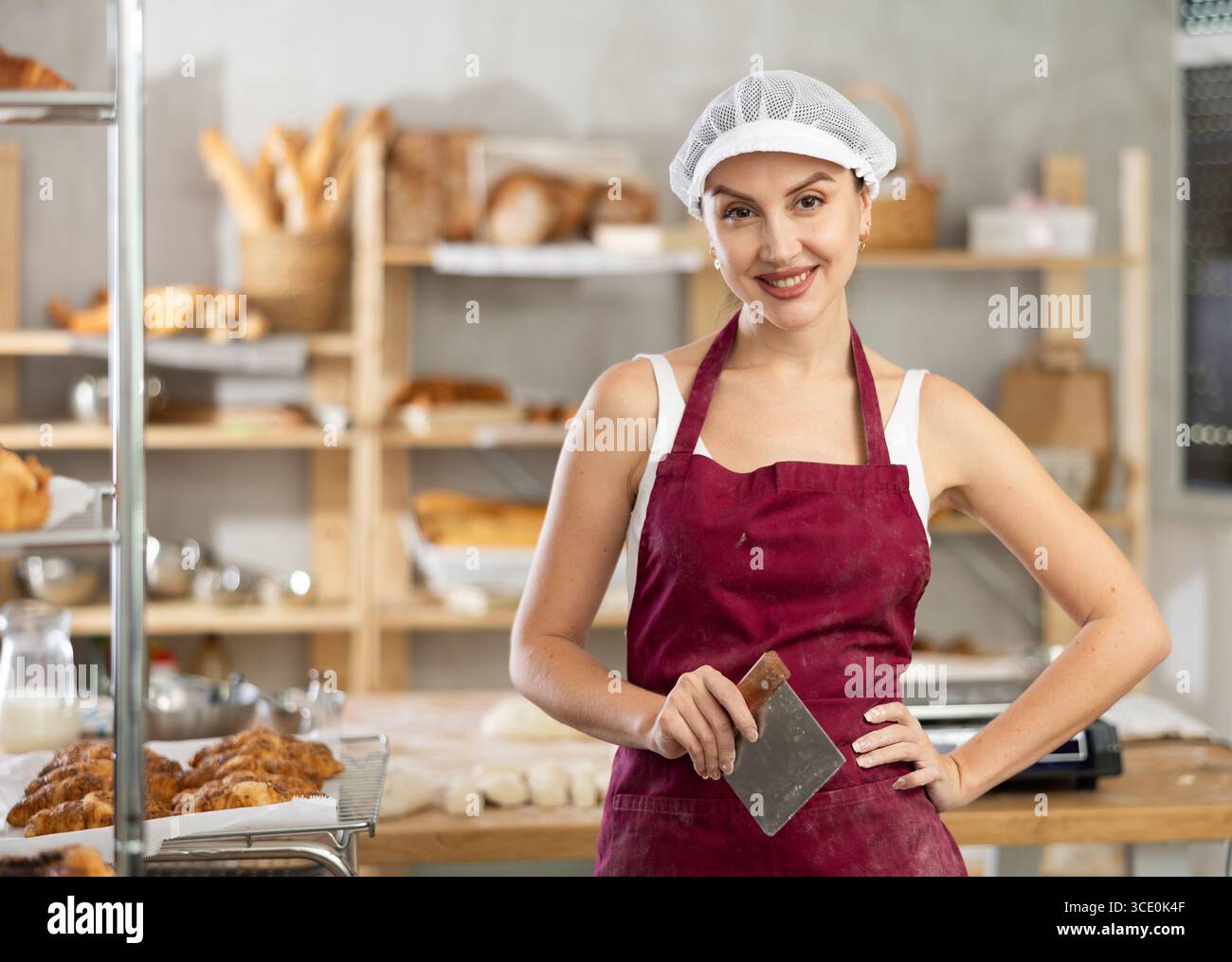 Young woman cutting slice dough hi-res stock photography and images - Alamy