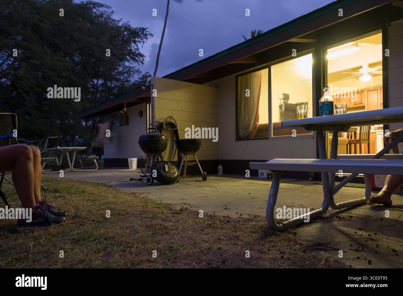 People sitting outside the rest and relaxation cabins at night, Bellows ...