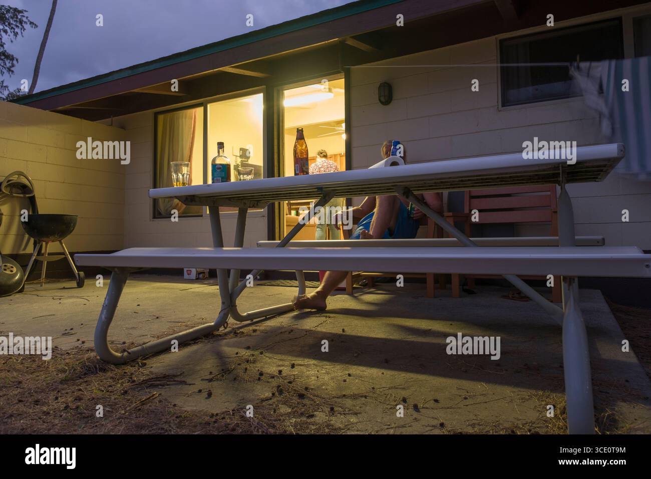 People sitting outside the rest and relaxation cabins at night, Bellows ...