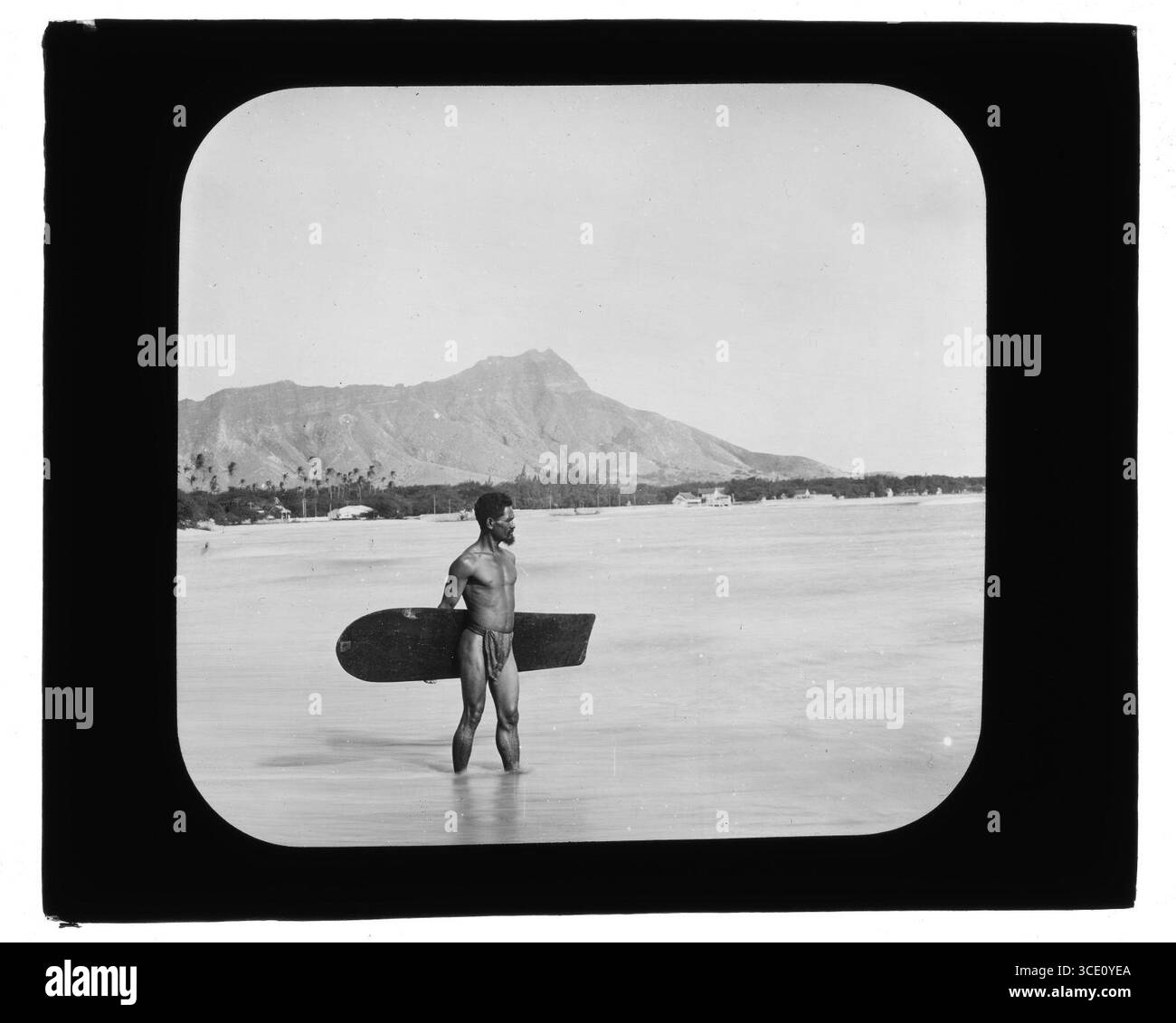 Native Hawaiian surfer standing with alaia board (GLS-9-3-0909 ...