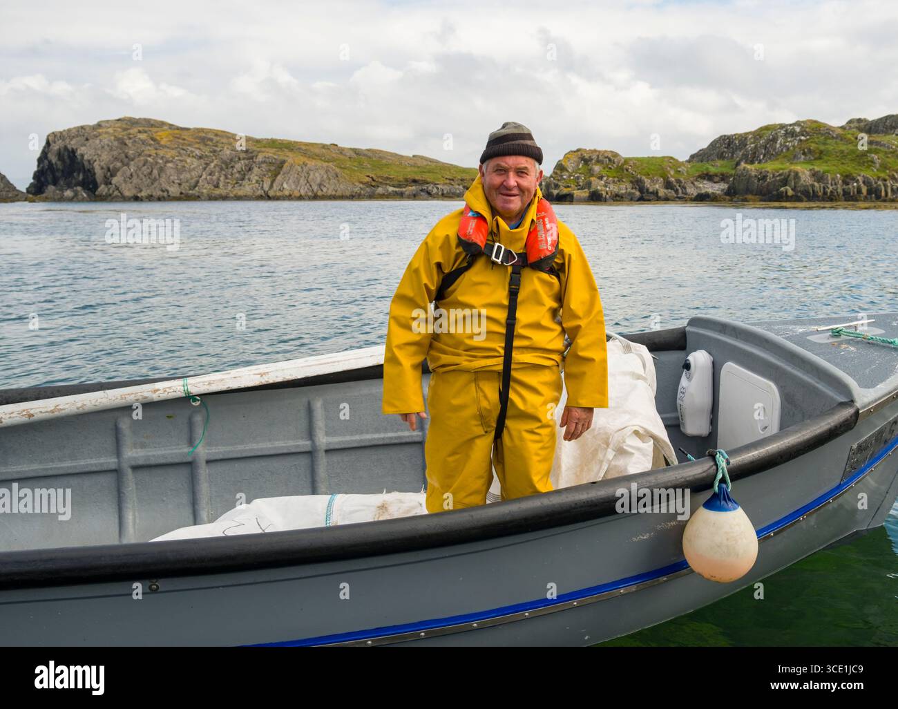 Irish man wearing yellow slicker rain suit and automatic inflating ...