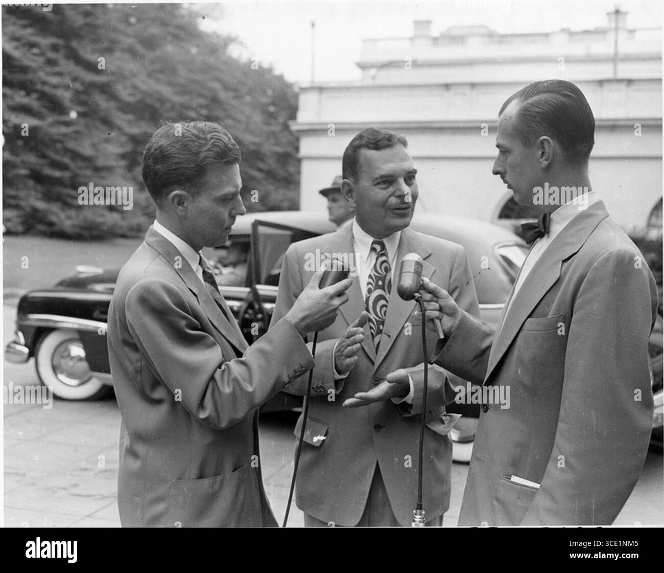 New York Governor Thomas E. Dewey speaks with unidentified reporters ...