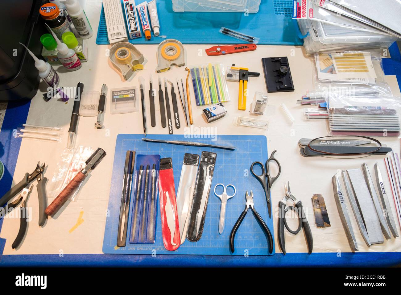 Specialized tools used for assembling scale models on work bench, USA ...