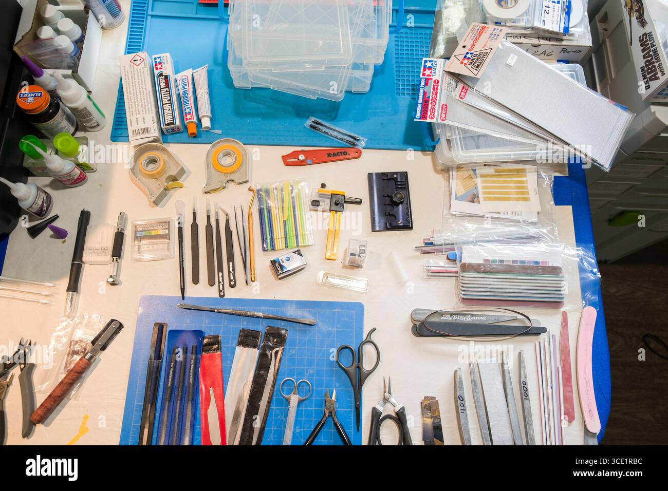 Specialized tools used for assembling scale models on work bench, USA ...