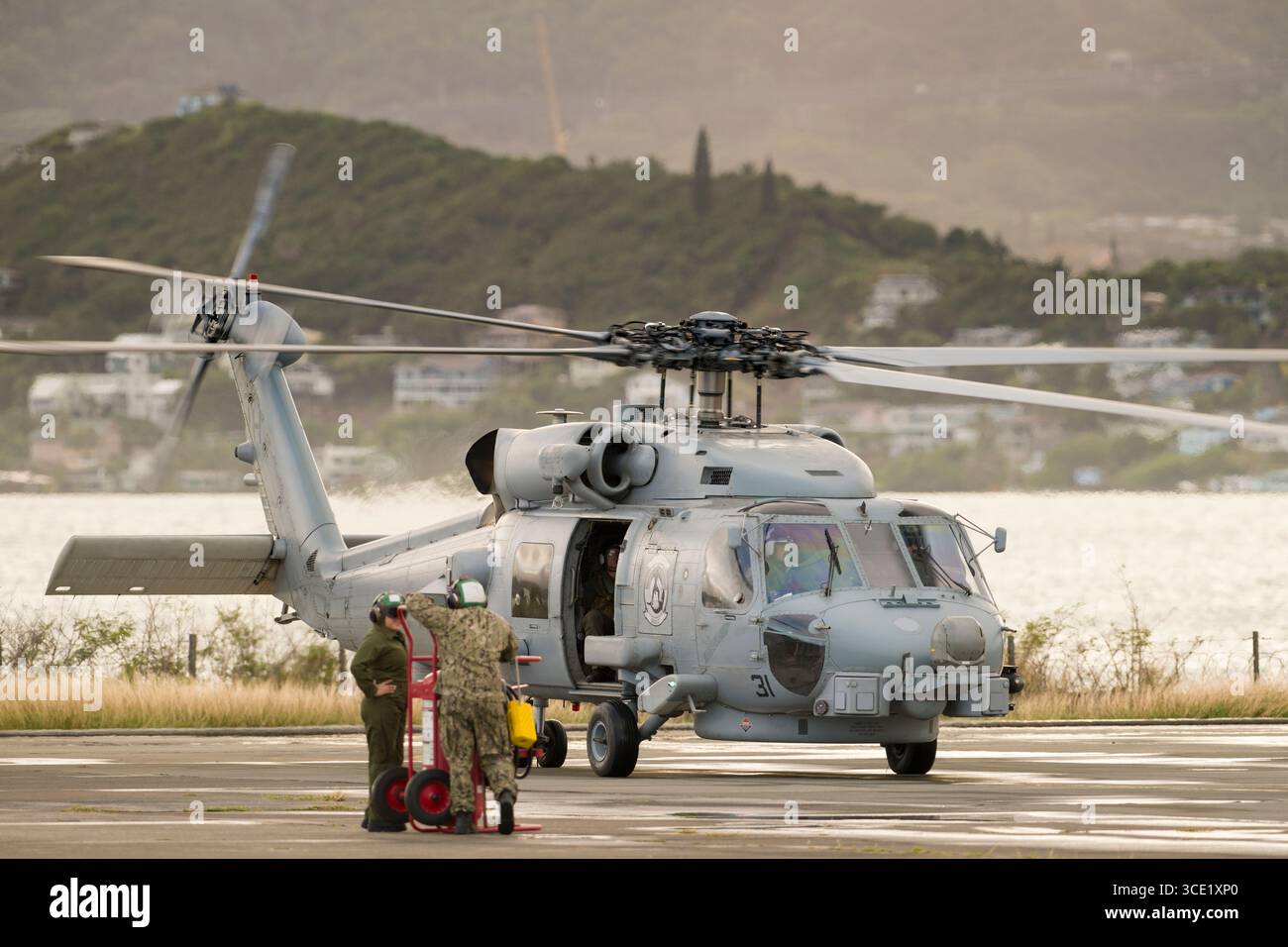 Ground crew unloading and servicing Sikorsky SH-60R Seahawk, Marine ...