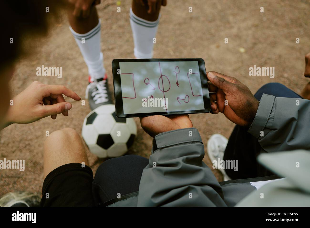 Boys Discussing Soccer Tactics Using Digital Tablet Outdoors Stock ...