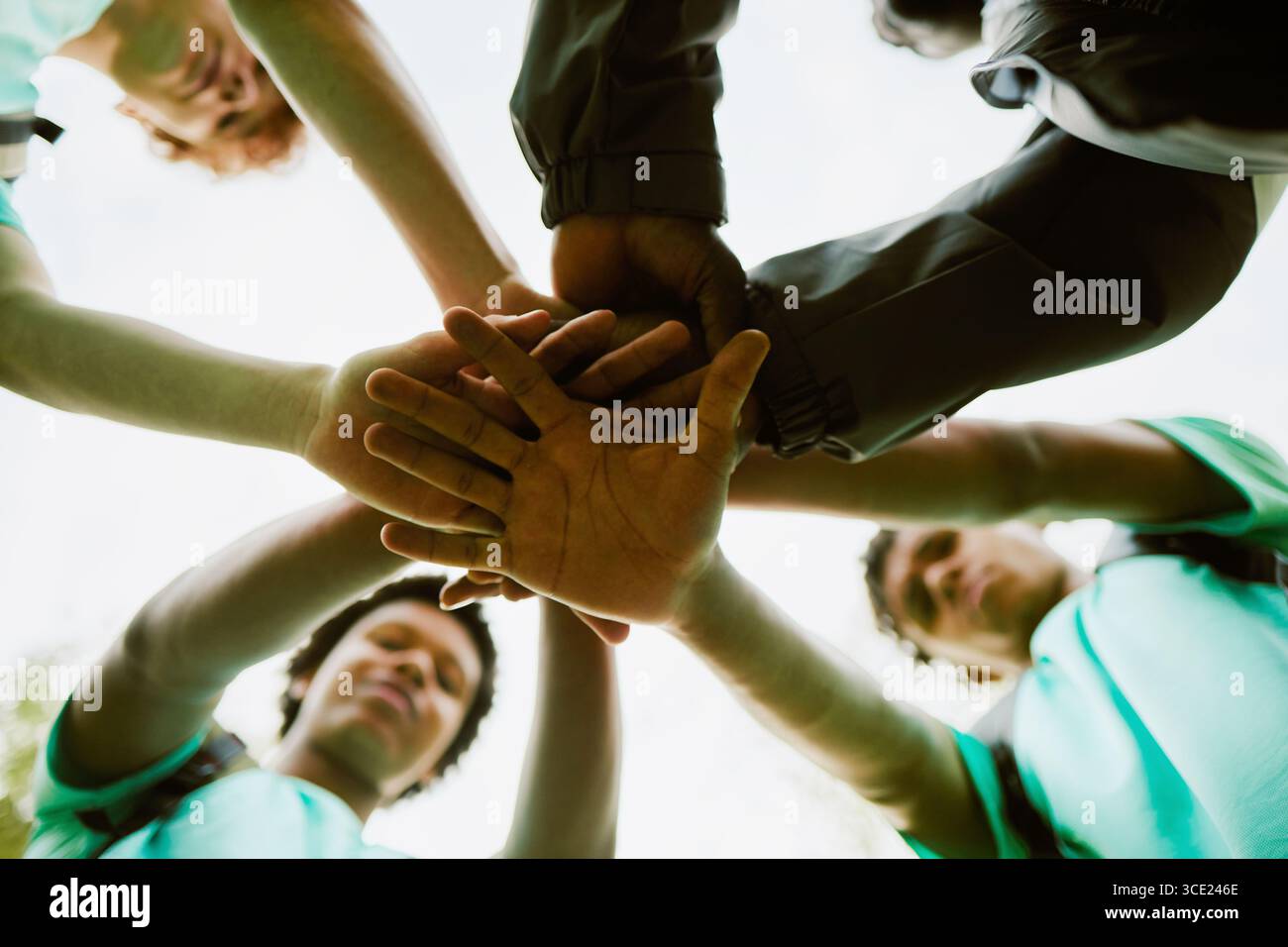 Diverse Teenagers Stacking Hands in Teamwork Gesture Outdoors Stock ...