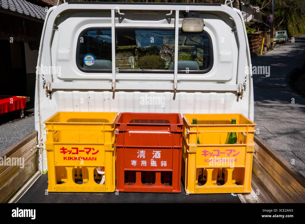 Plastic bins in the back of a small utility truck, Sagatoriimoto ...