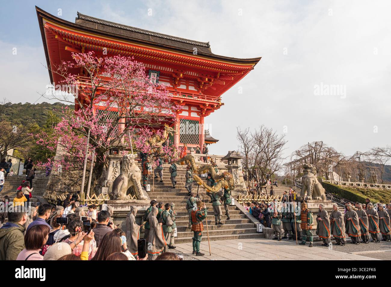 Male performers holding wood poles supporting the Seiryu blue dragon ...
