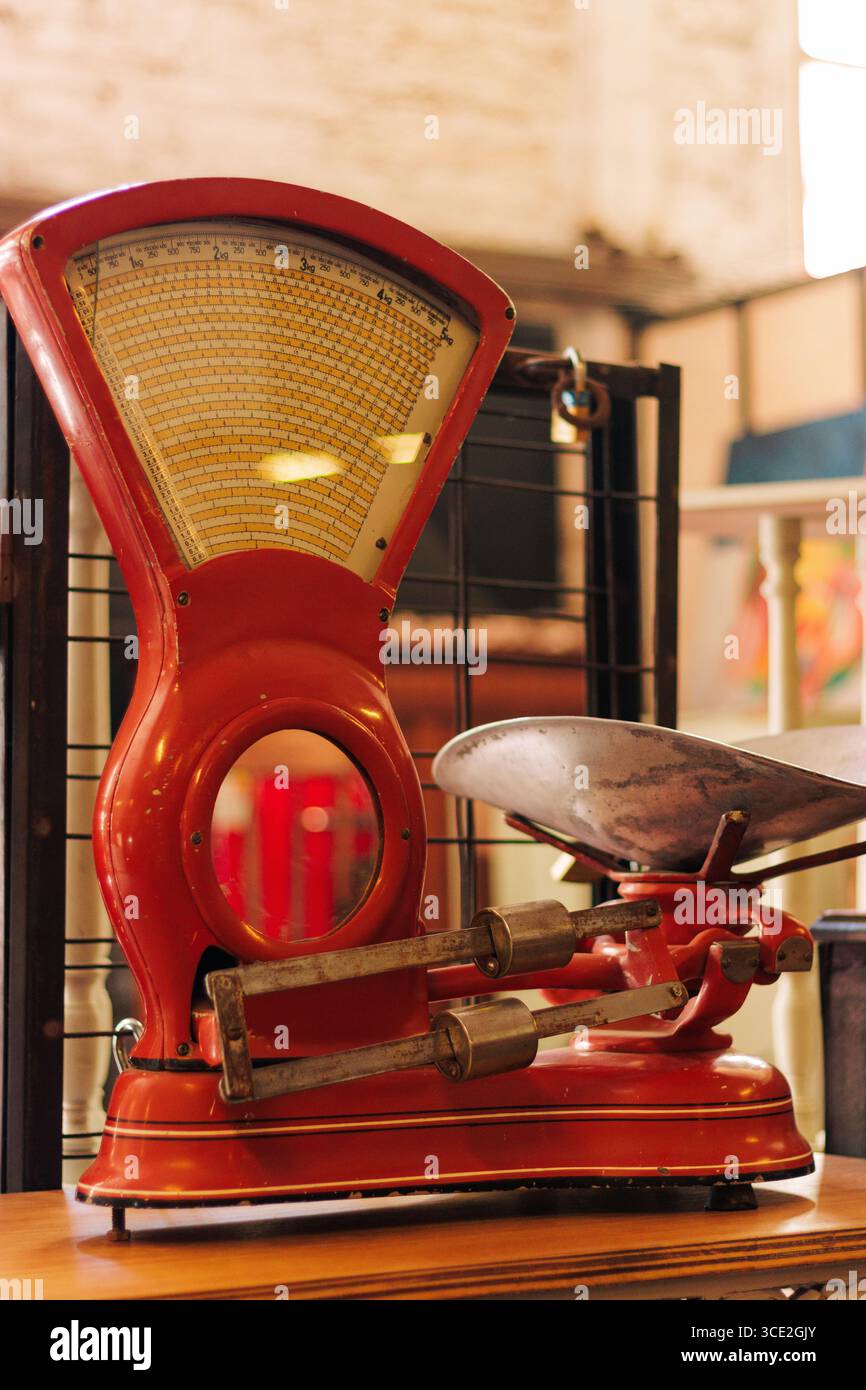 Antique scale or scale from a local business, red in color Stock Photo ...