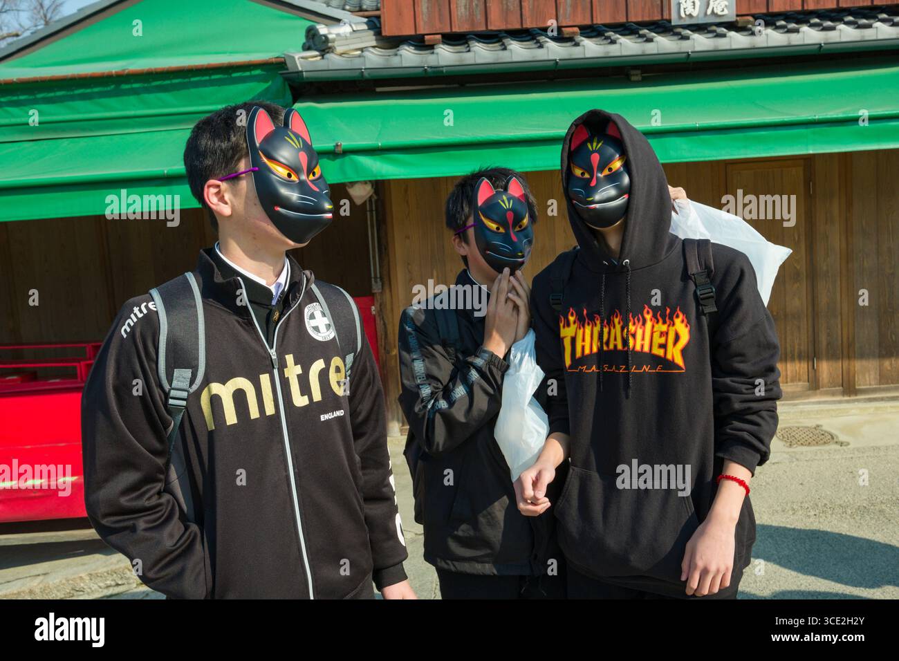 Teenaged boys wearing fox masks, Fushimi Inari Taisha Shinto shrine ...