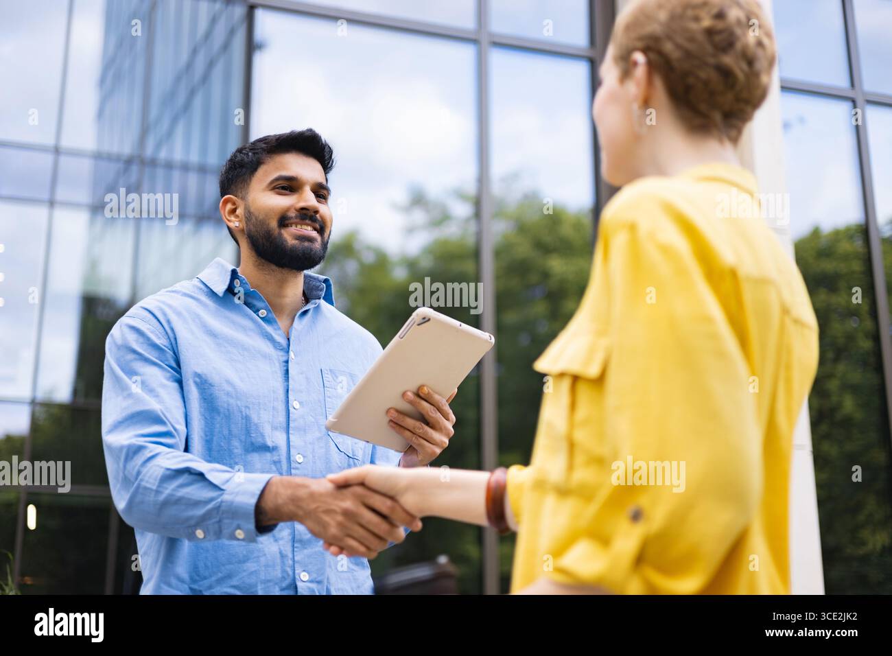 Business Handshake in Front of Office Stock Photo - Alamy
