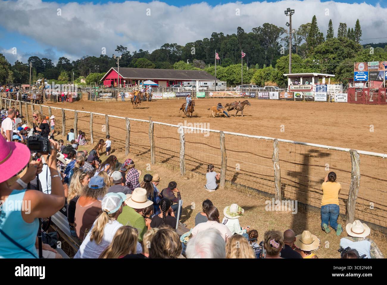 Spectators sitting and standing on bleachers during the 54th annual ...