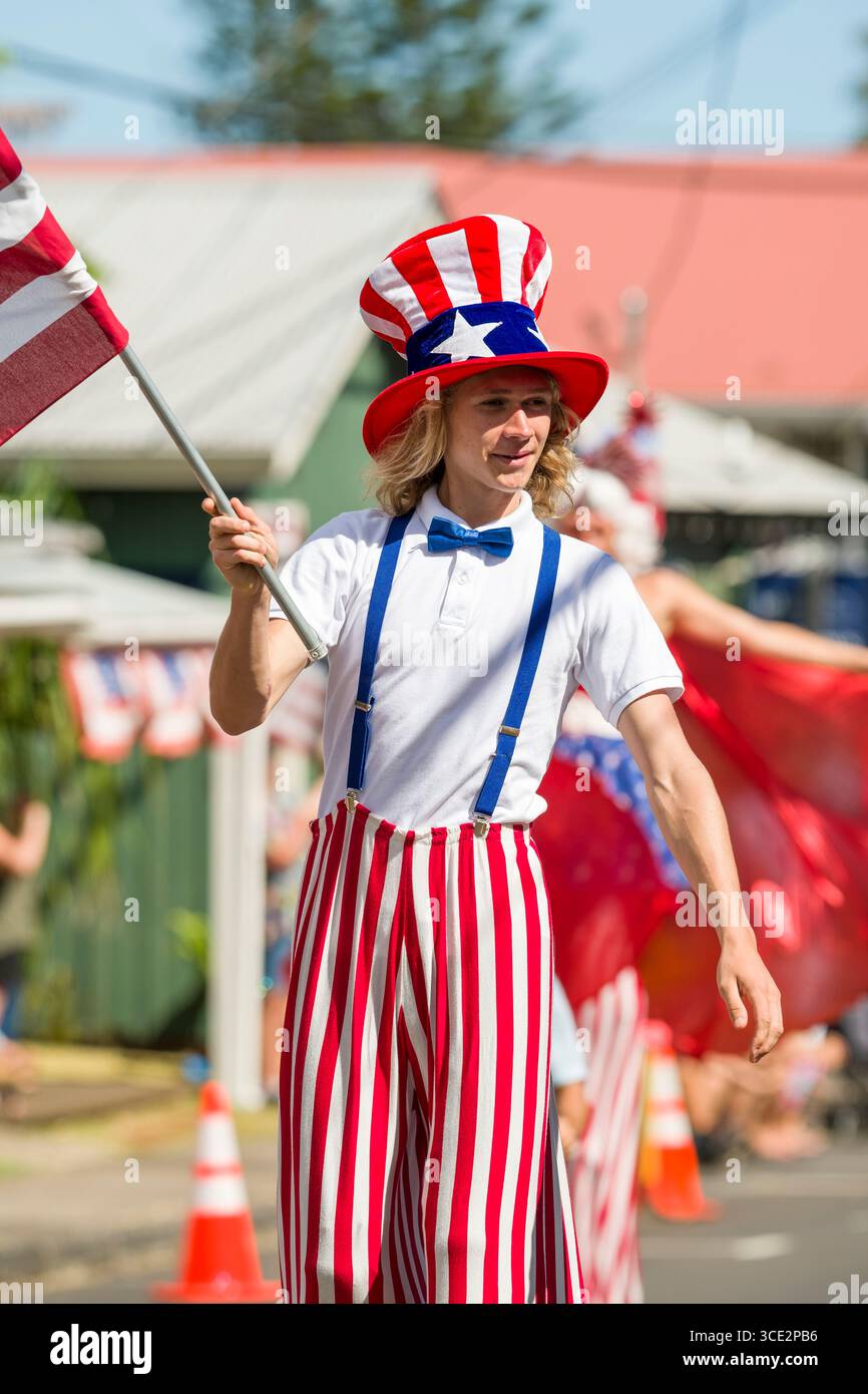 Man walking on stilts dressed in a red, white and blue patriotic Uncle ...