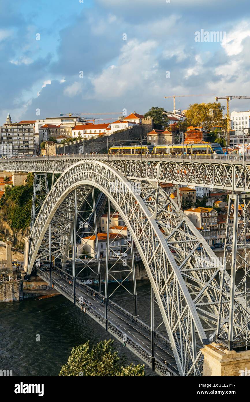 Iconic Dom Luis I iron arch bridge spans Douro River connecting Porto ...