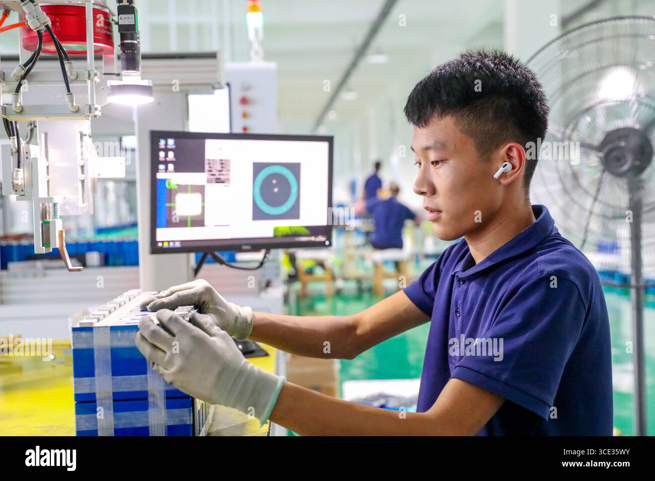 LINYI, CHINA - AUGUST 14, 2025 - A worker is performing laser welding ...