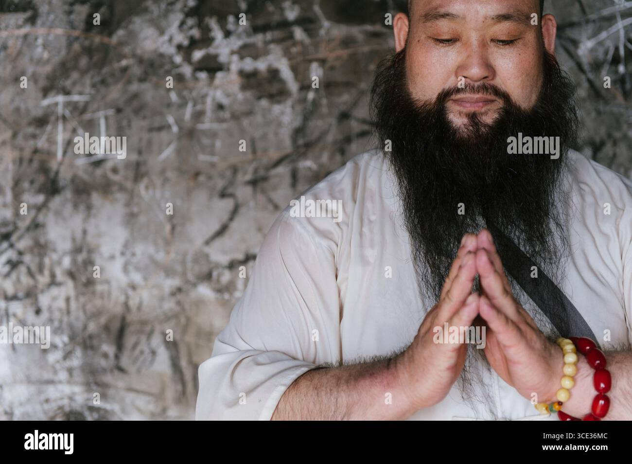 Shaolin monk, Shi De Chao poses for portraits and demonstrates various ...