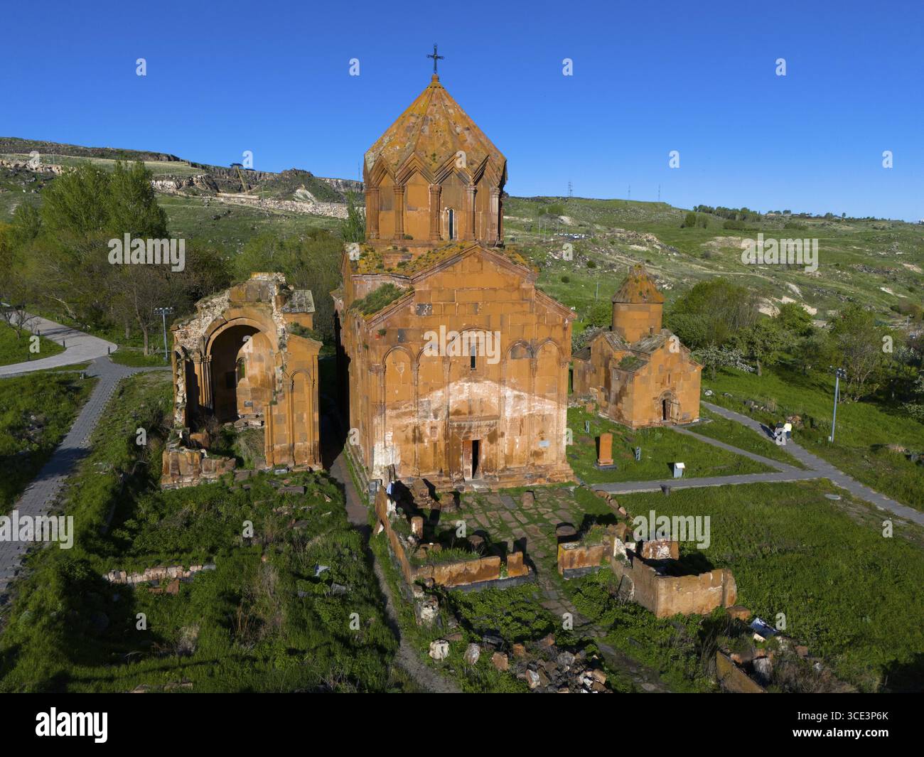 A detailed picture of an old monastery surrounded by green nature under ...
