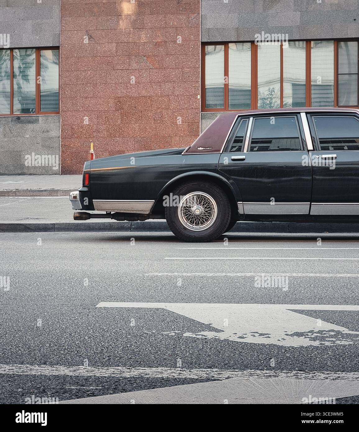 Black Chevrolet Caprice parked on a street - rear part. Side profile ...