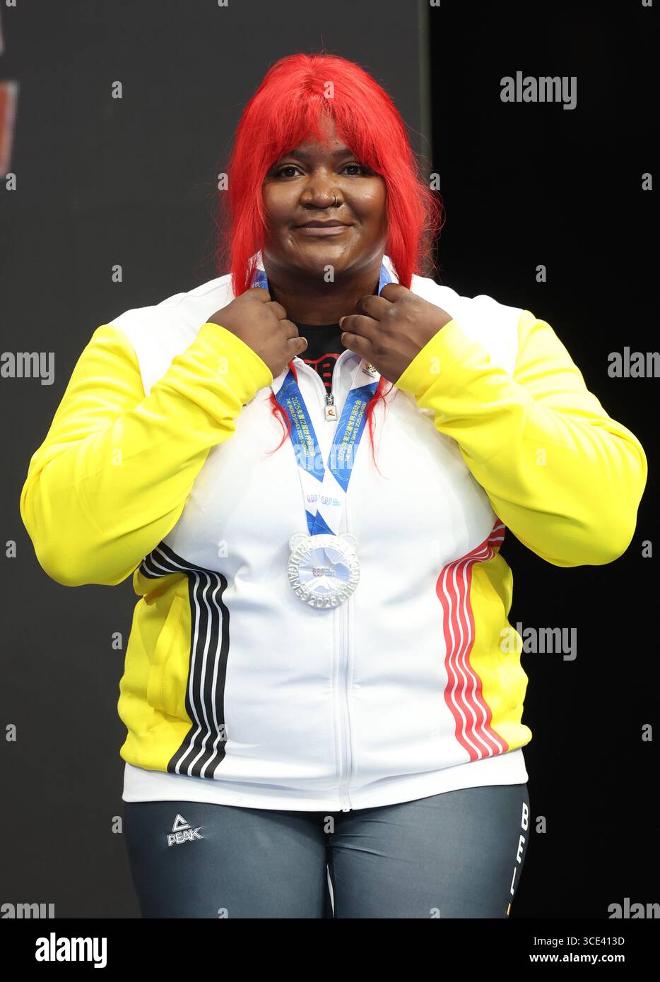 Belgian Sonita Muluh celebrates on the podium after winning silver ...