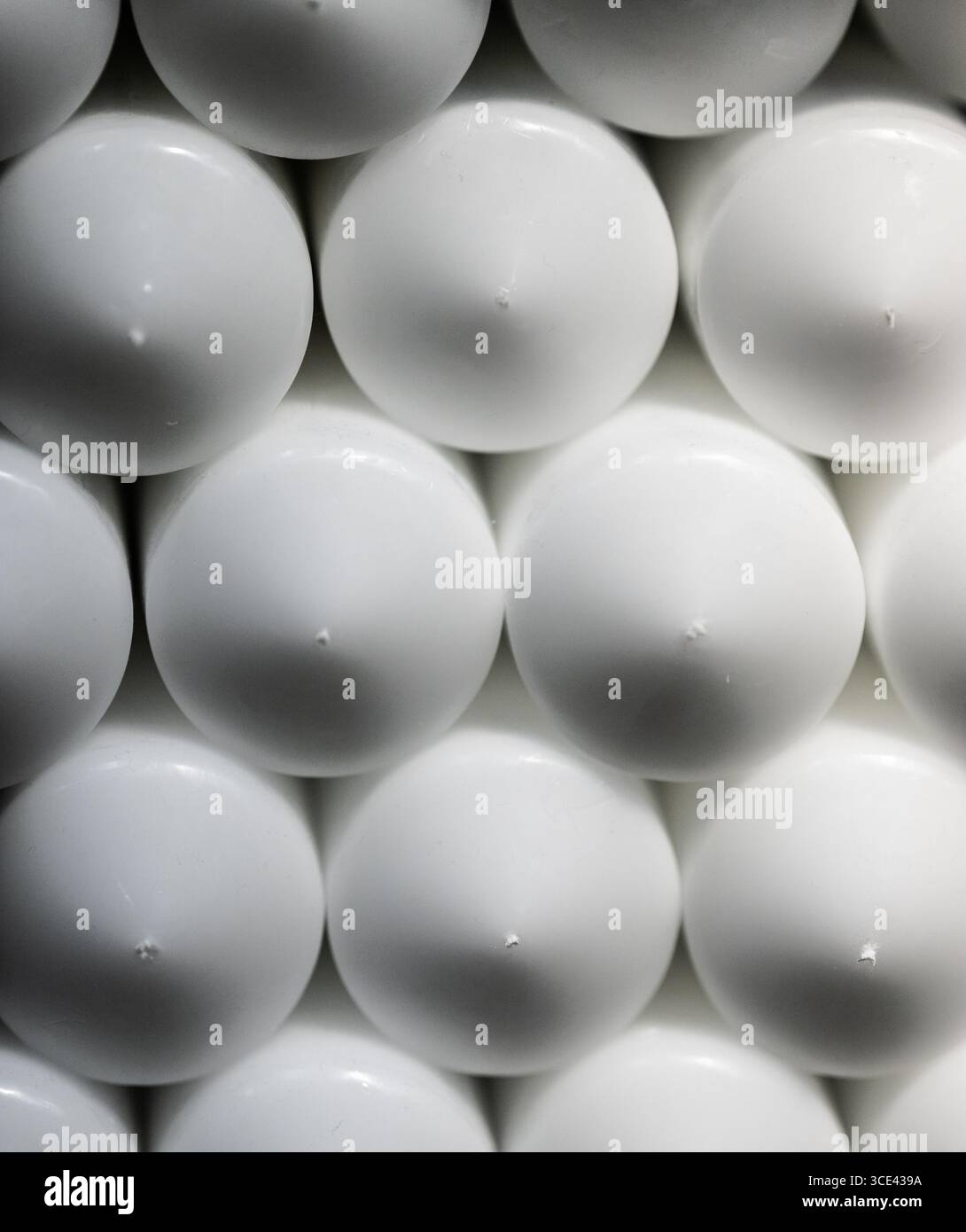 Pile of white block stearin candles Stock Photo - Alamy