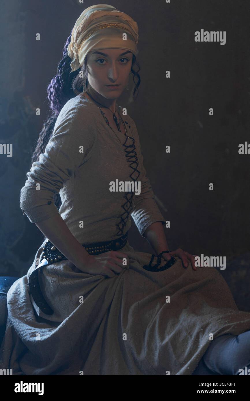 Mysterious medieval witch in gypsy-style costume, alluring and powerful ...