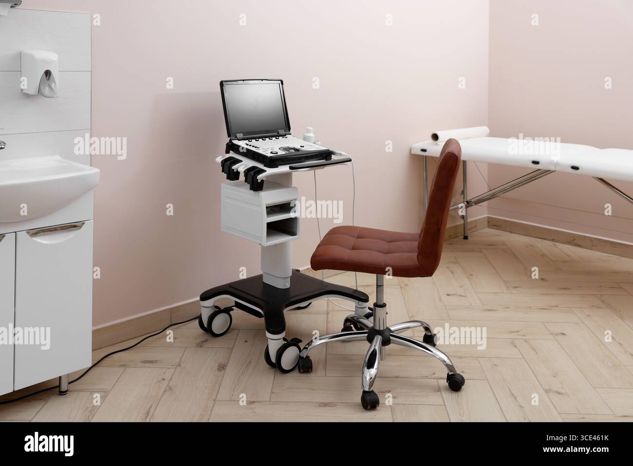Modern ultrasound machine, chair and examination bed in clinic Stock ...