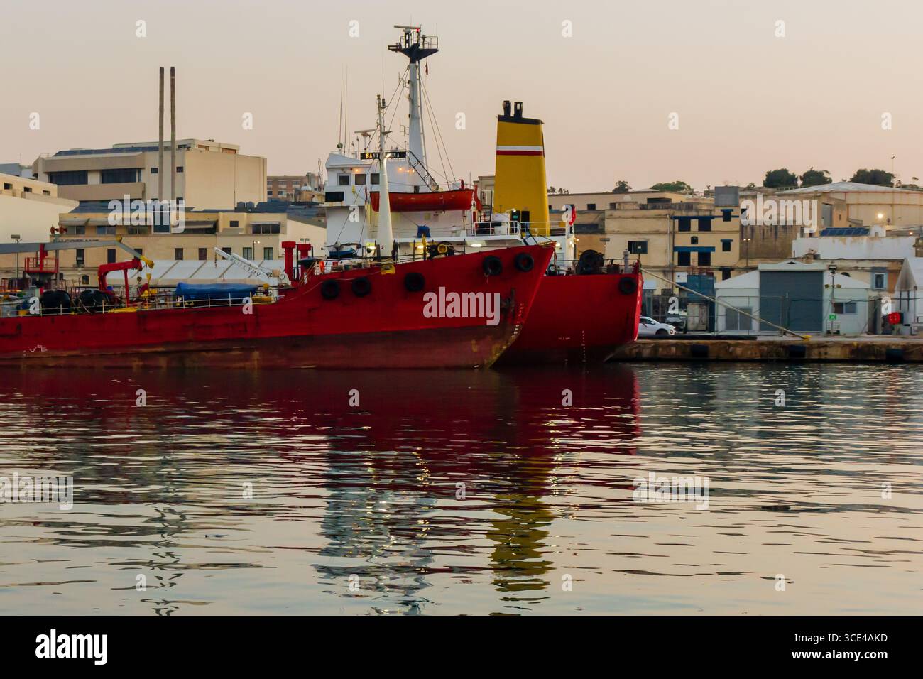 Cargo ship sailing sunset hi-res stock photography and images - Alamy