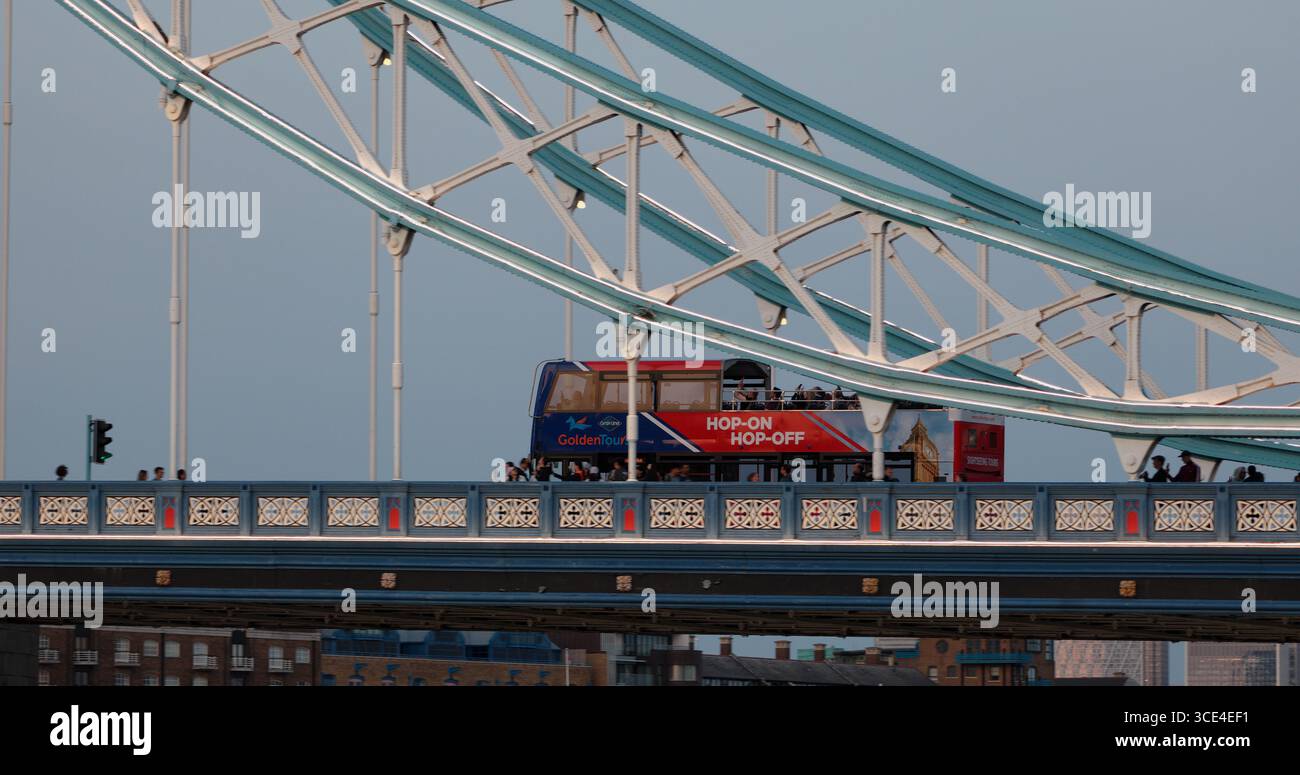 LONDON, UK - AUGUST 5, 2025 - Red London bus driving across Tower ...