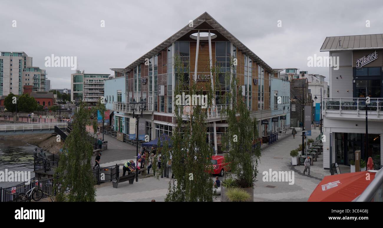CARDIFF, UK - AUGUST 8, 2025 - Modern buildings, shops, restaurants and ...
