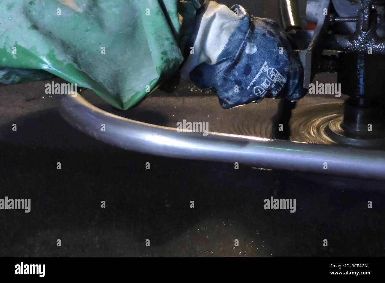 Polishing a granite panel using a grinder on a machine Stock Photo - Alamy