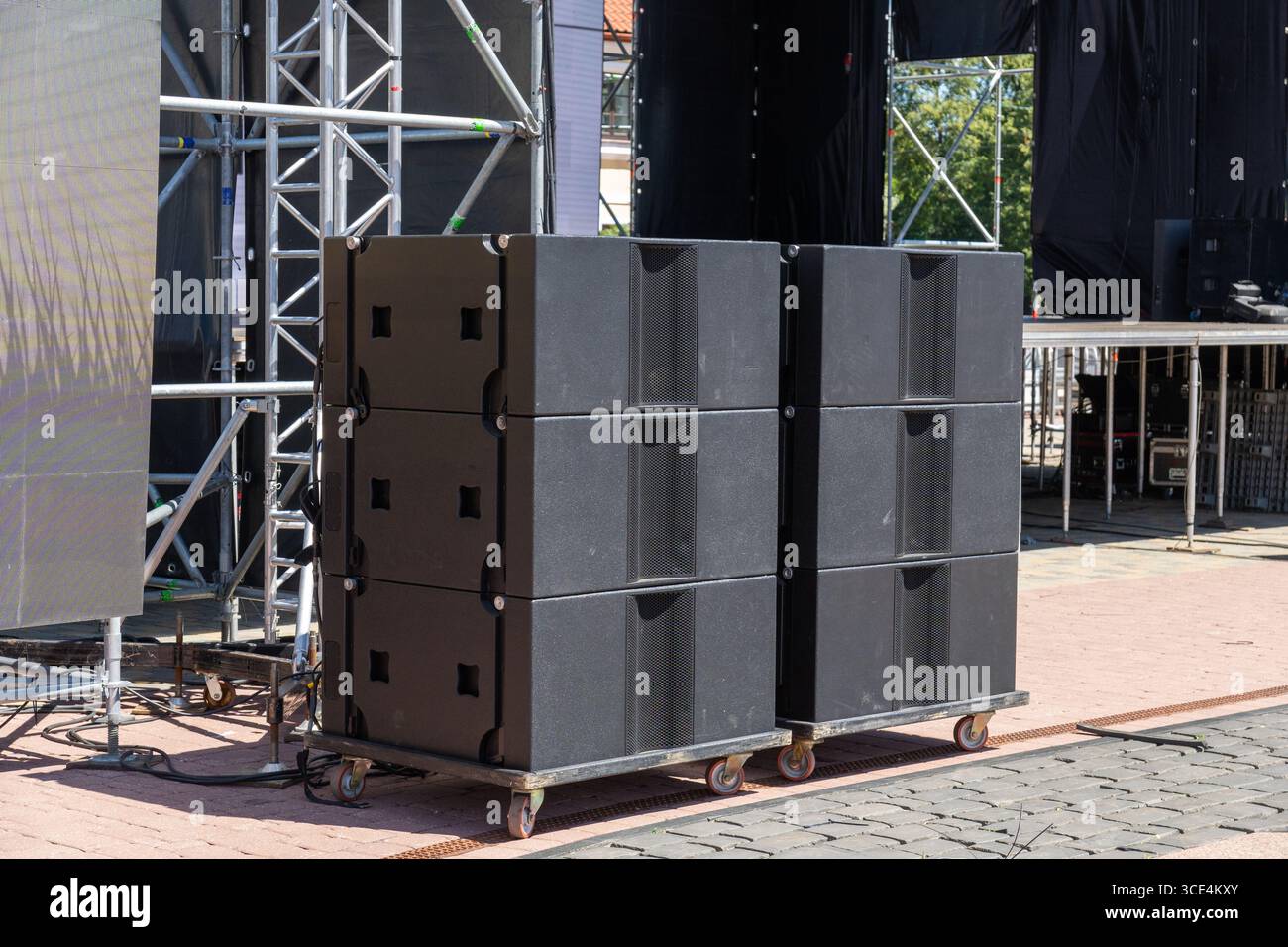 Professional concert acoustic systems set up on an open-air stage for a ...