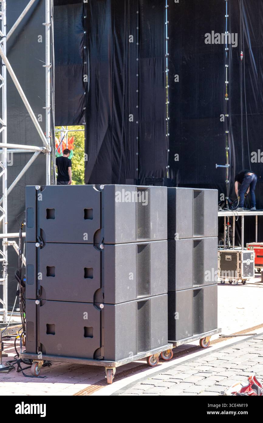 Professional concert acoustic systems set up on an open-air stage for a ...