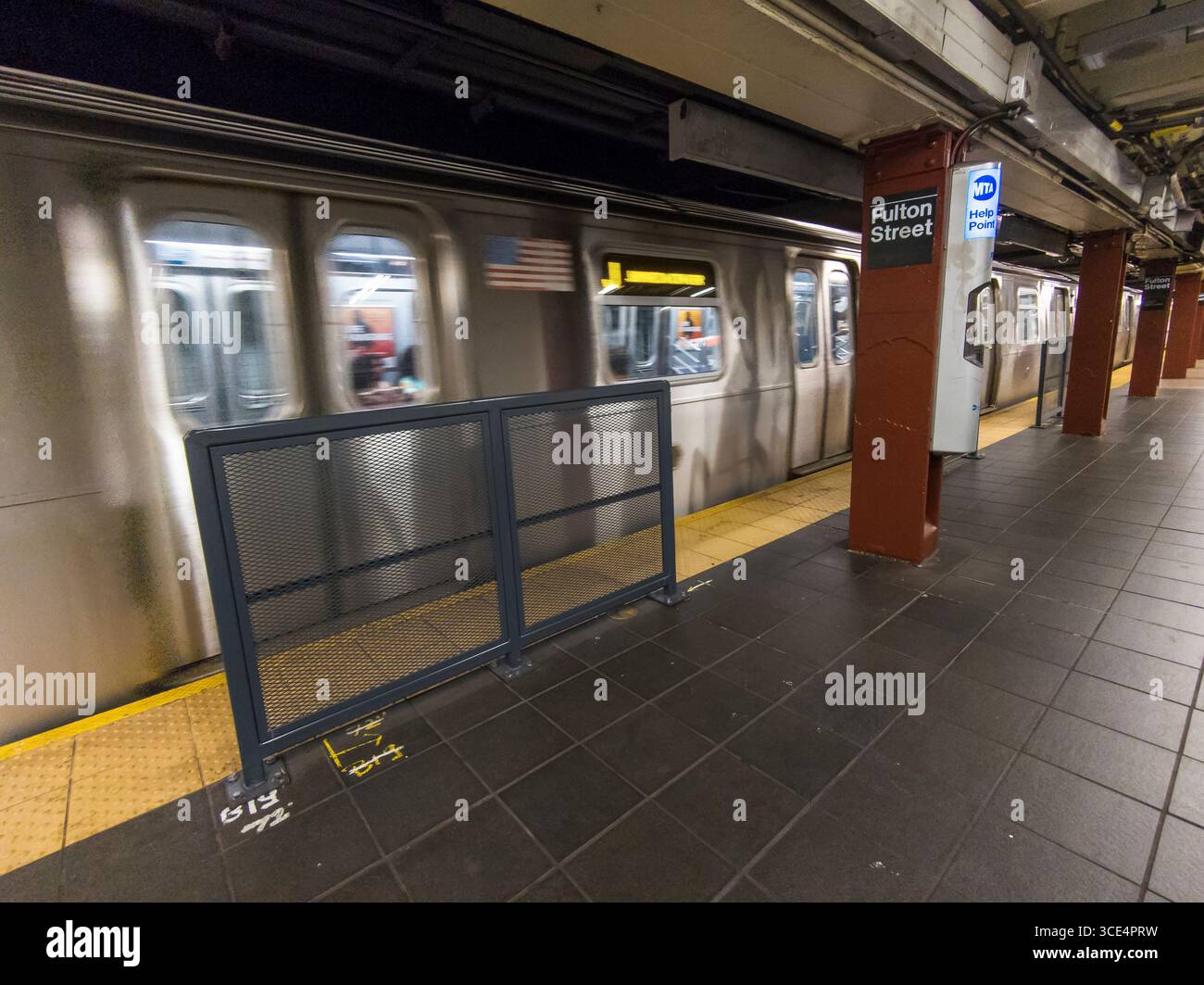 Newly installed barriers at the platform edge in the Fulton Street ...