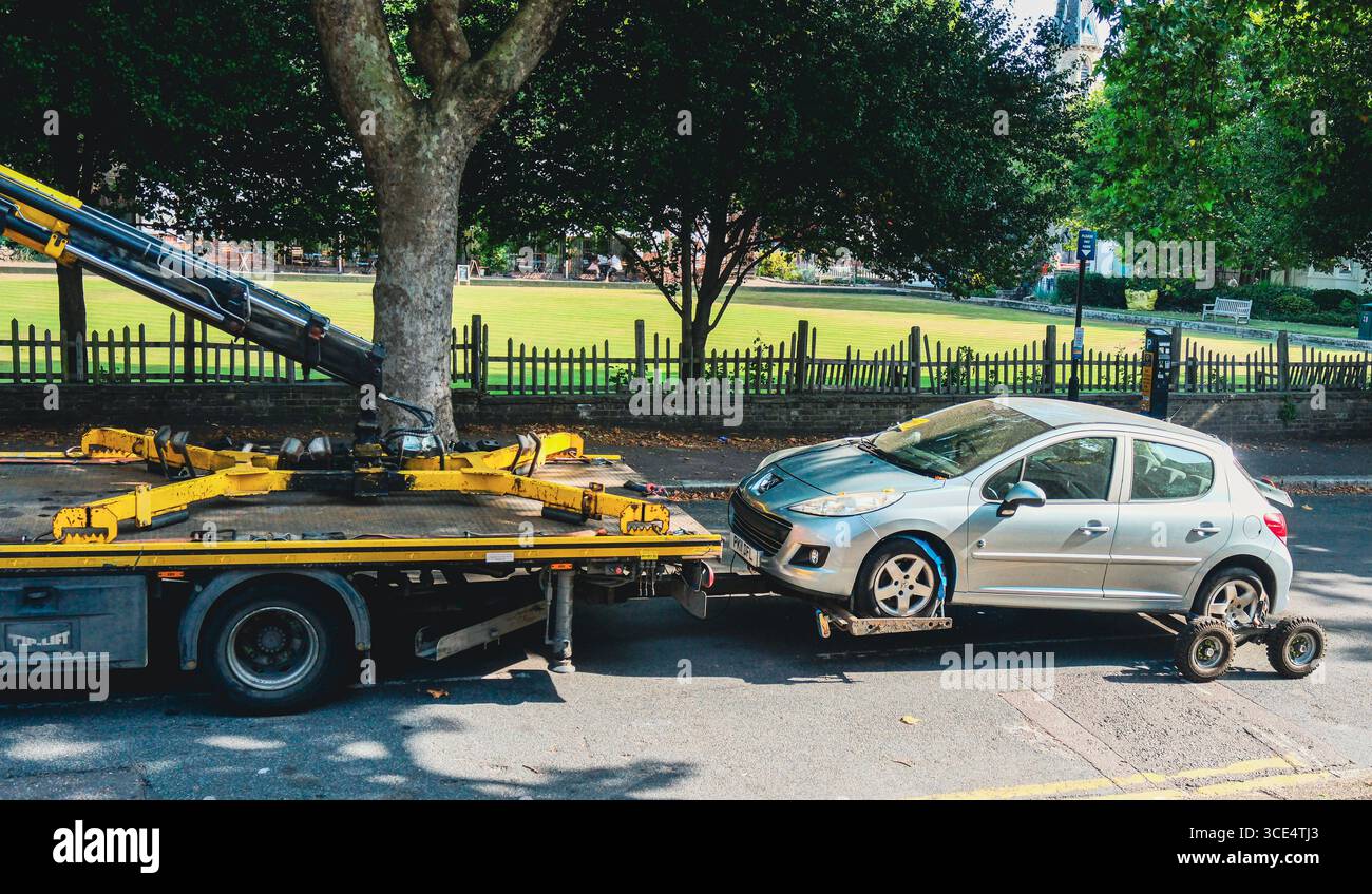 An untaxed vehicle is towed away Stock Photo - Alamy