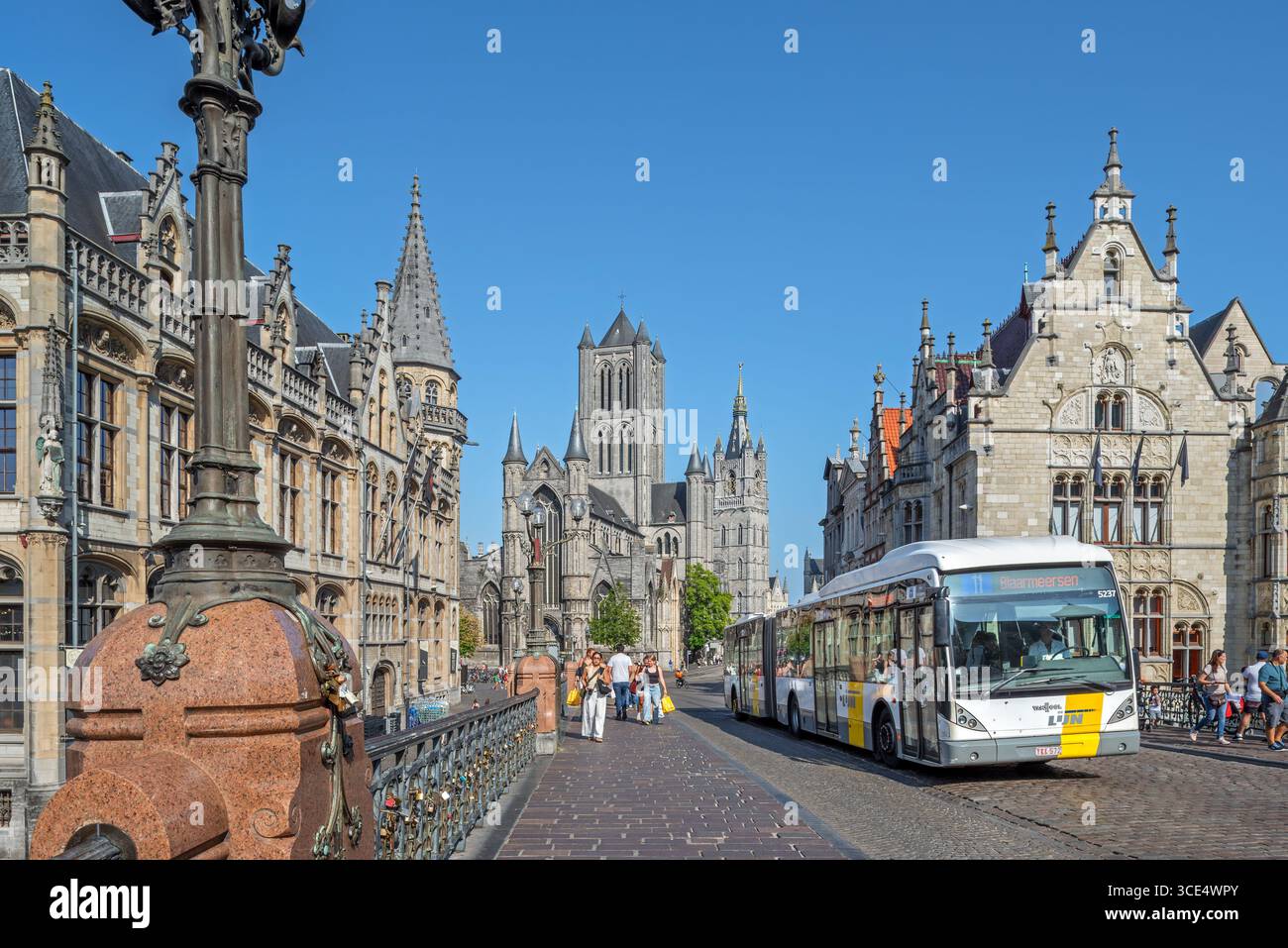Bus of De Lijn riding over St Michael’s Bridge in pedestrianised area ...