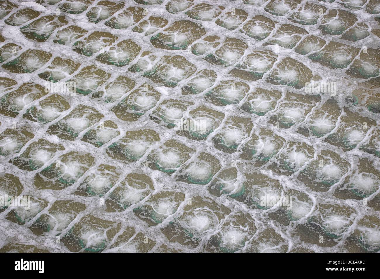 Biological treatment process in aeration basin closeup. Specialized ...