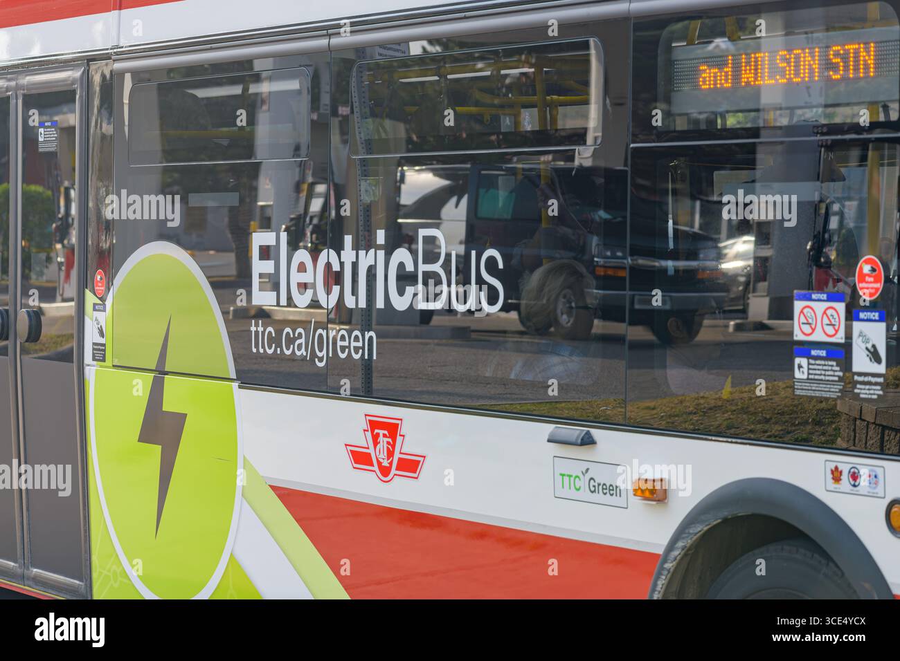 A Toronto Transit Commission electric bus shows branding for TTC Green ...