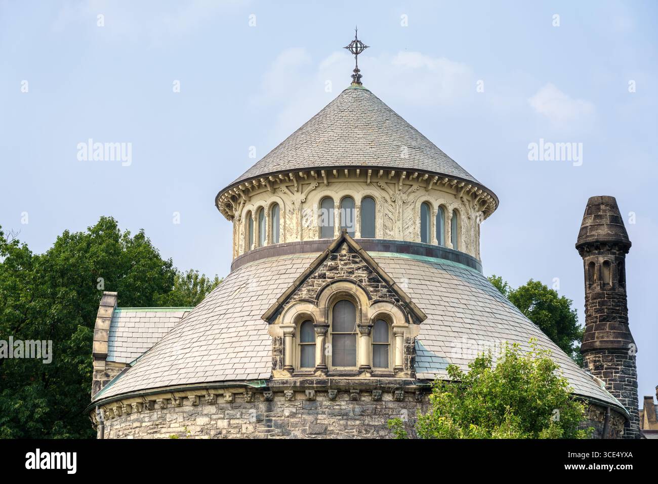Round tower with arched windows and slate roof at St. George Campus ...