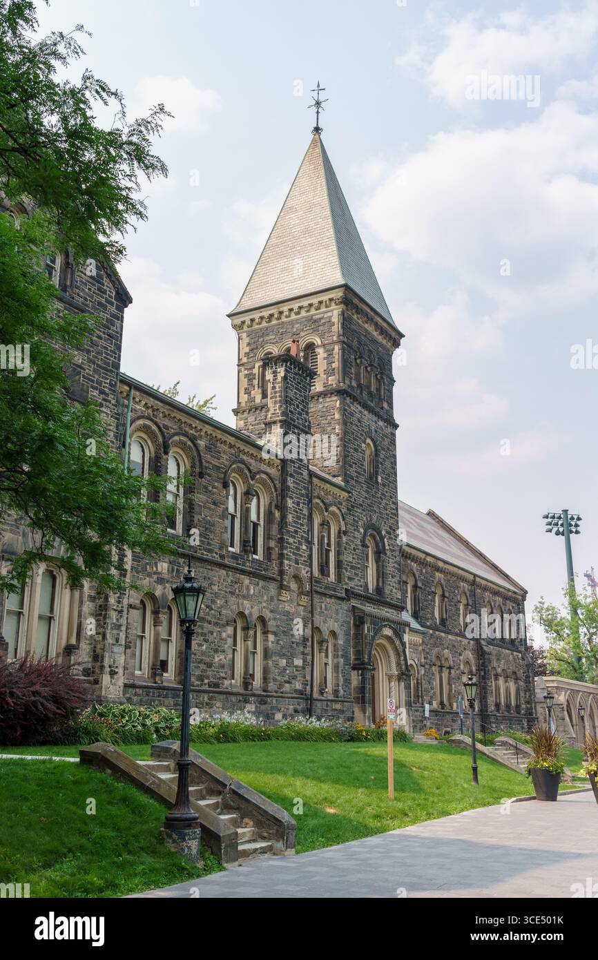 Stone building with a tall, pointed tower at St. George Campus ...