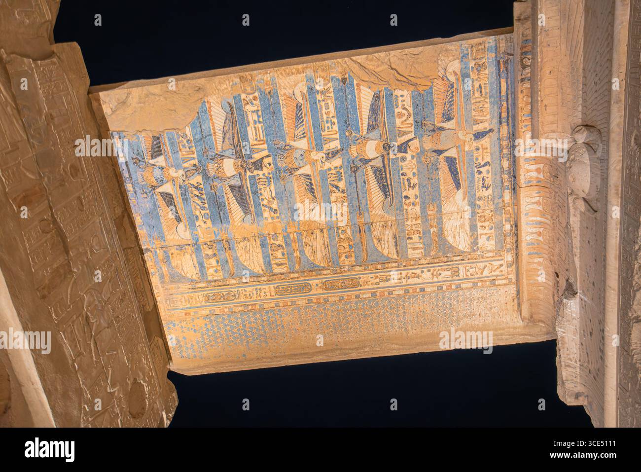 Ancient Egyptian ceiling art with blue painted hieroglyphs and ...