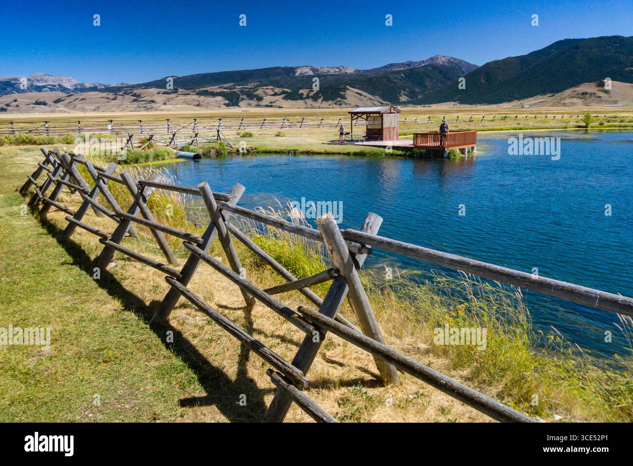 Buck and pole fence around small pond at the Jackson National Fish ...