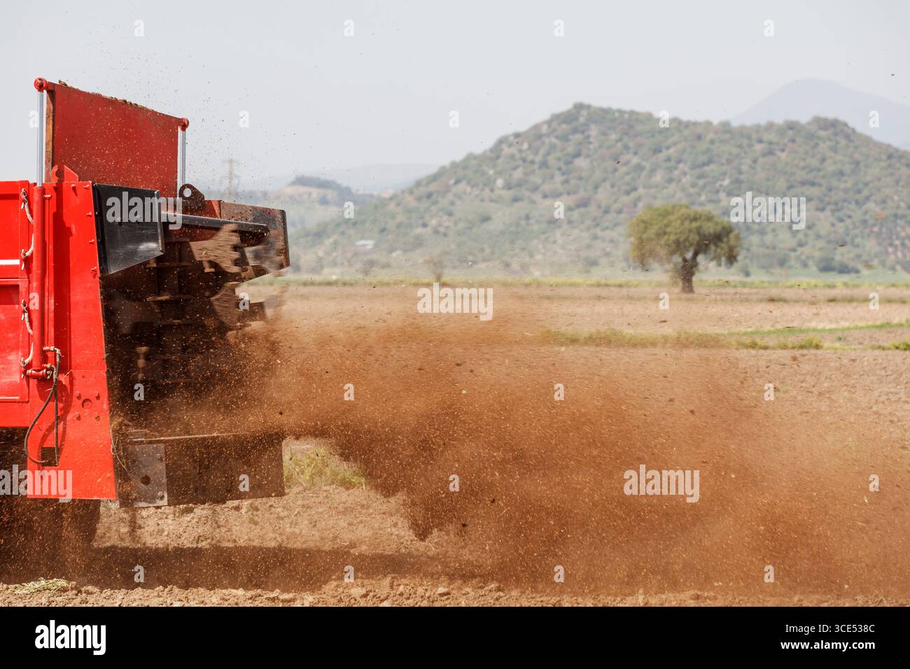 Agricultural scene of farmer manure spreading as agricultural ...