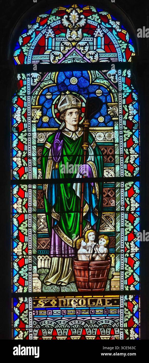 Rochefort, Belgium - July 23, 2025: Stained glass window showing Saint ...