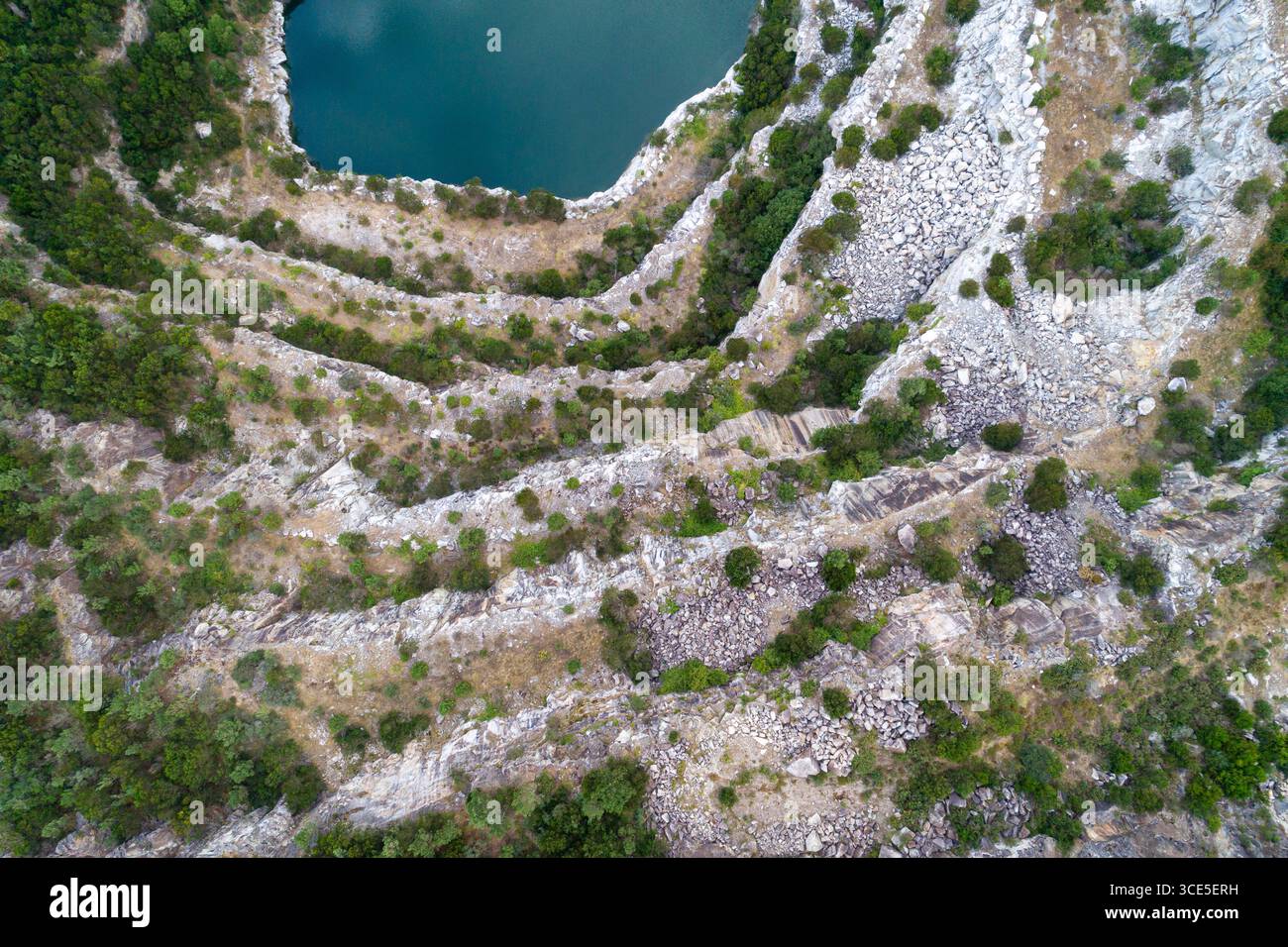 The beautiful and dramatic scenery of a quarry lake for a travel or ...