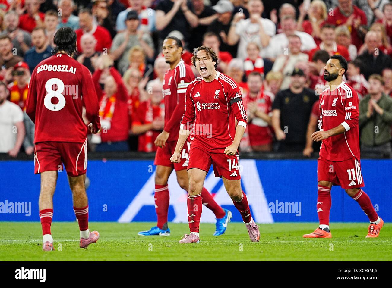 Liverpool's Federico Chiesa (centre) celebrates scoring their side's ...