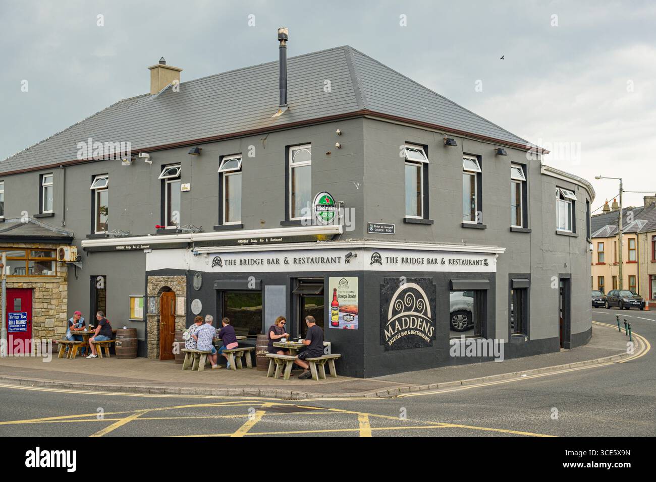 People sitting outside the Bridge Bar & Restaurant, Bundoran, County ...