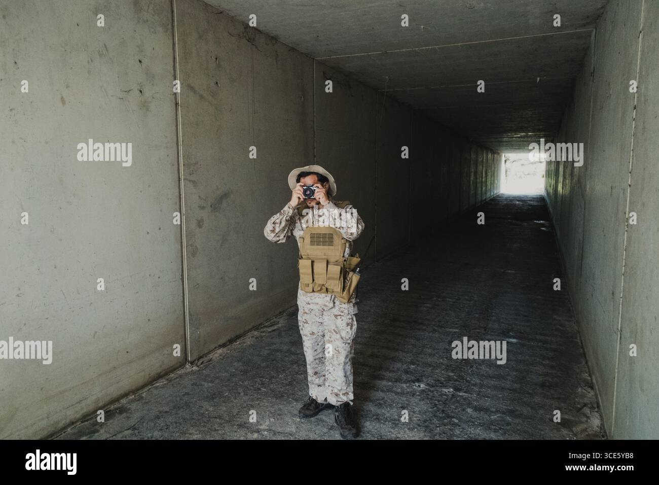 Soldier Using A Camera To Take Photos On A Mission Stock Photo - Alamy