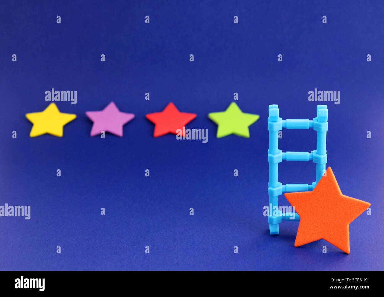 Placing the fifth star with a ladder Stock Photo - Alamy
