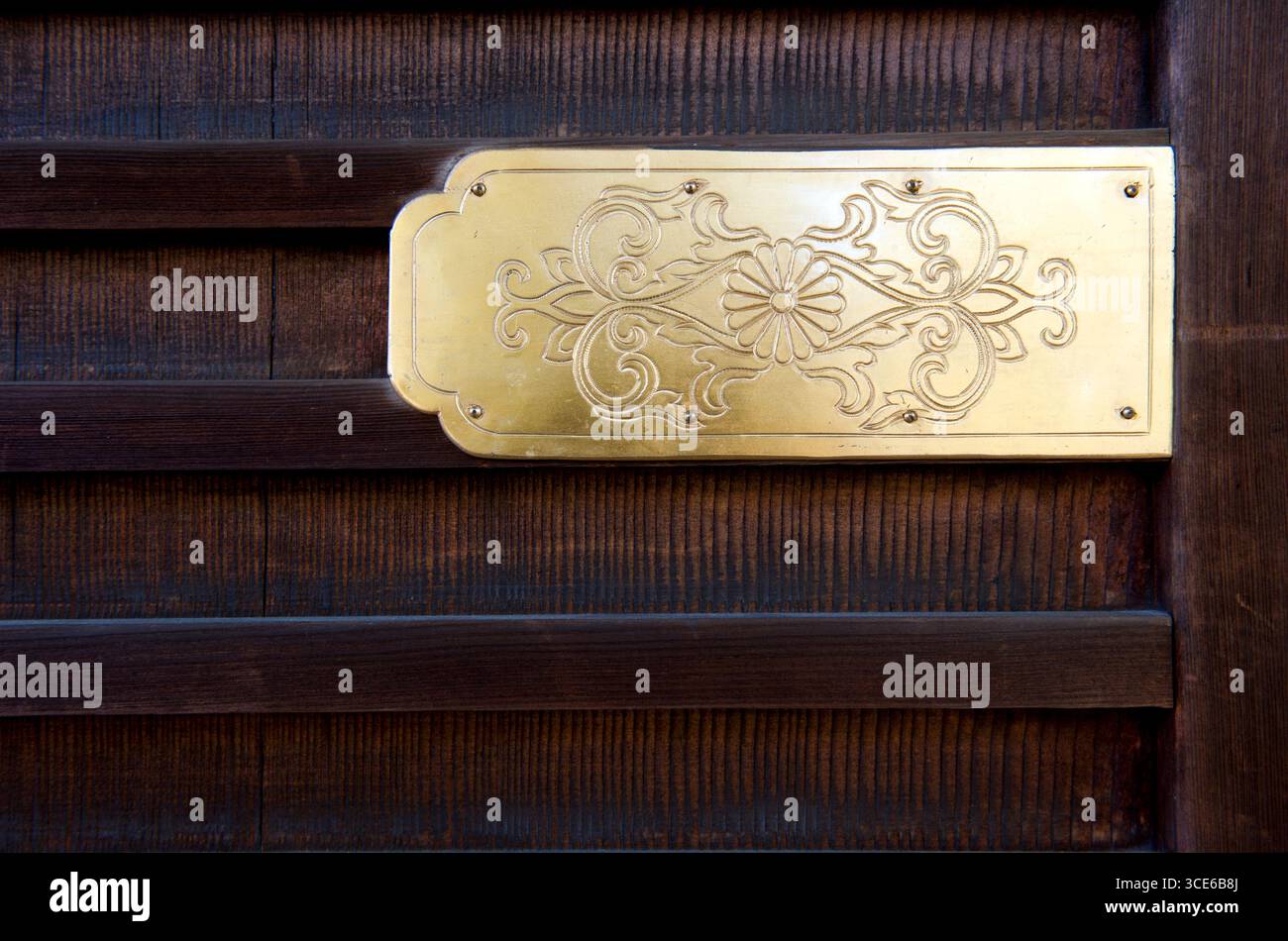 Sliding "fusuma" wooden door panel with a gold plate decoration with ...